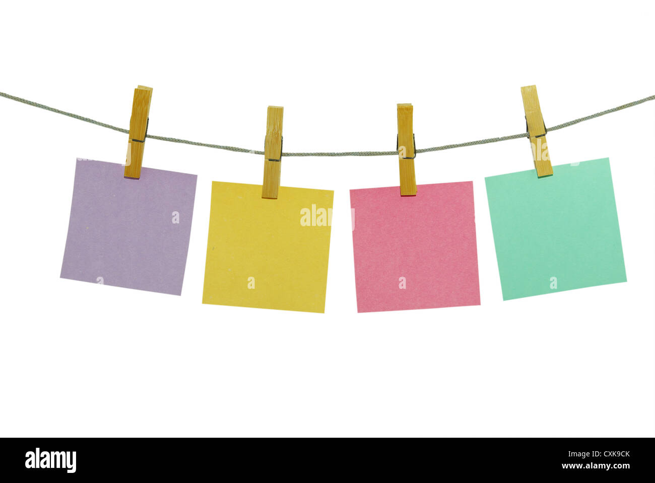 note paper blanks on rope isolated on white Stock Photo - Alamy