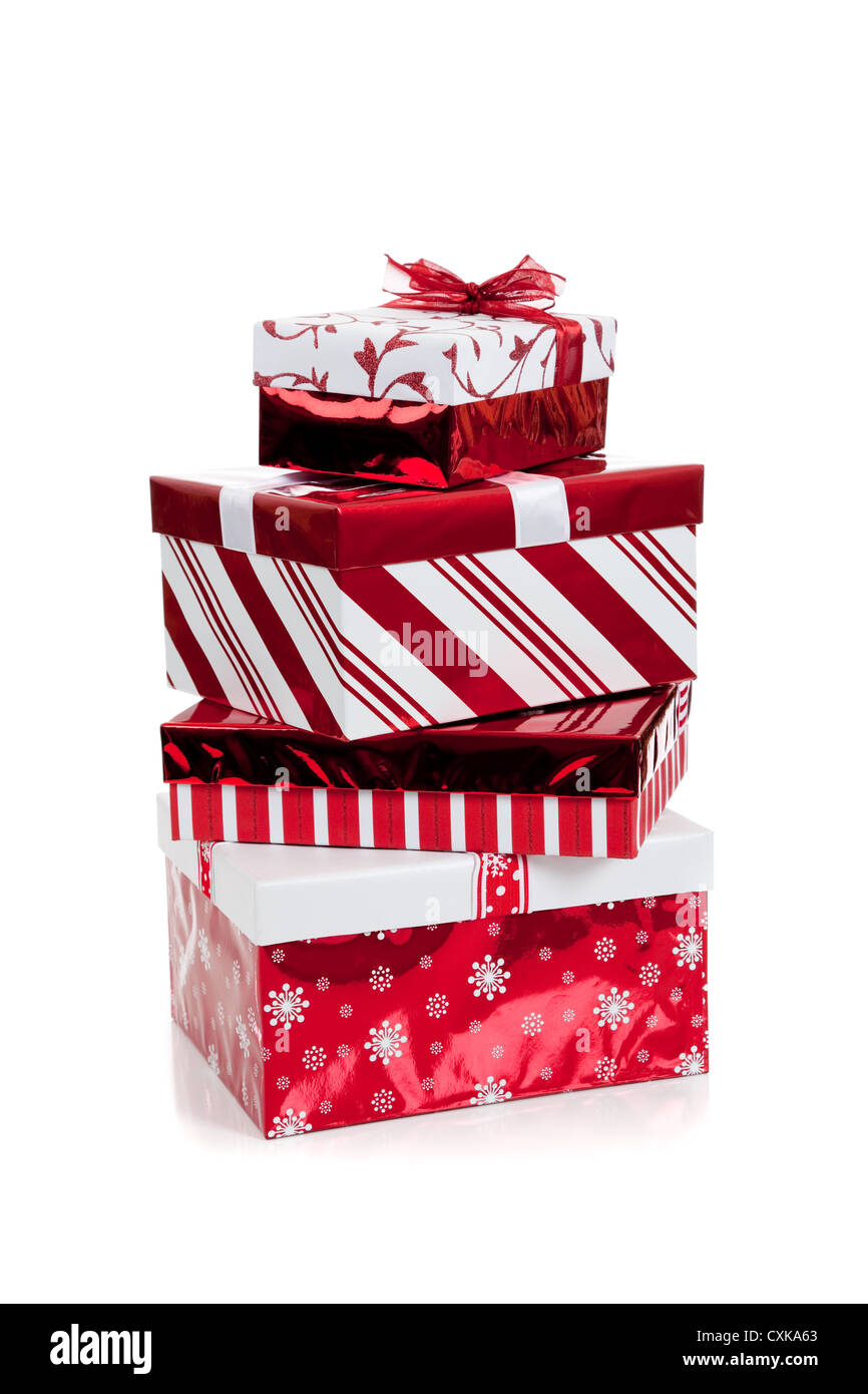 Stack of red and white wrapped Christmas presents on a white backgroung ...