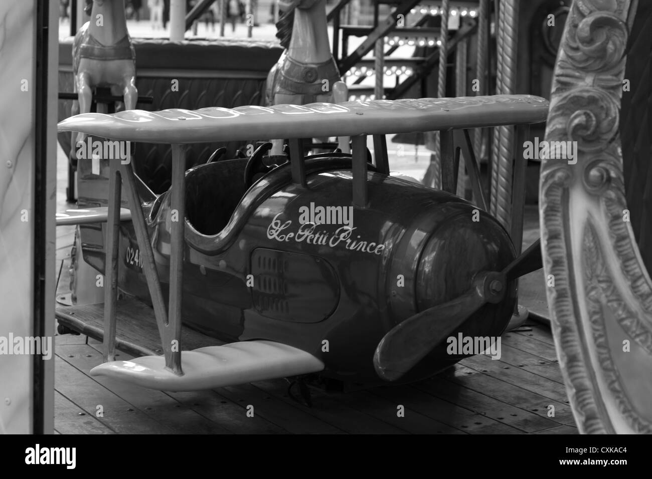 small plane on a merry go round Stock Photo - Alamy