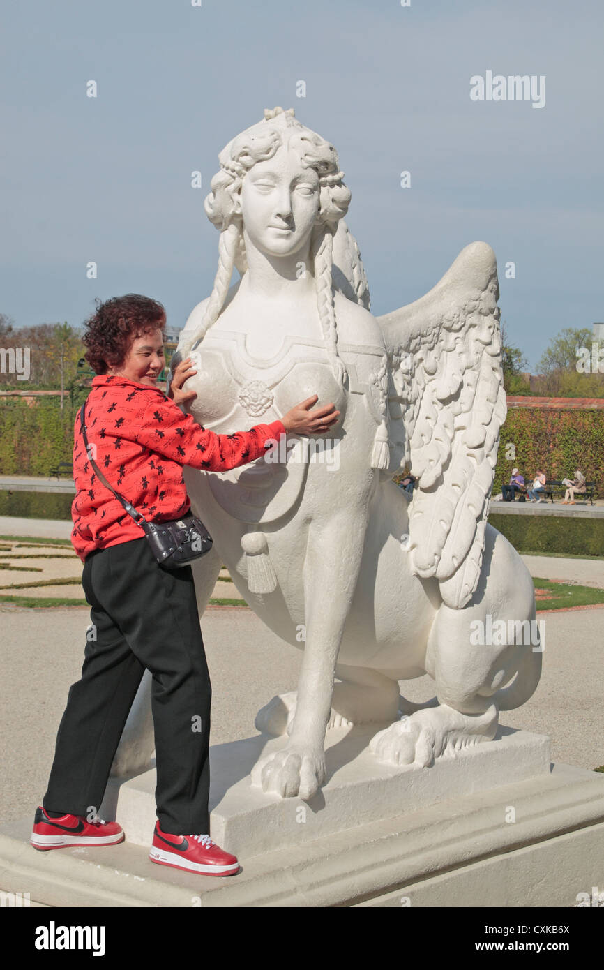 A smiling tourist 'fondling' the breasts on Sphinx statue in the ...