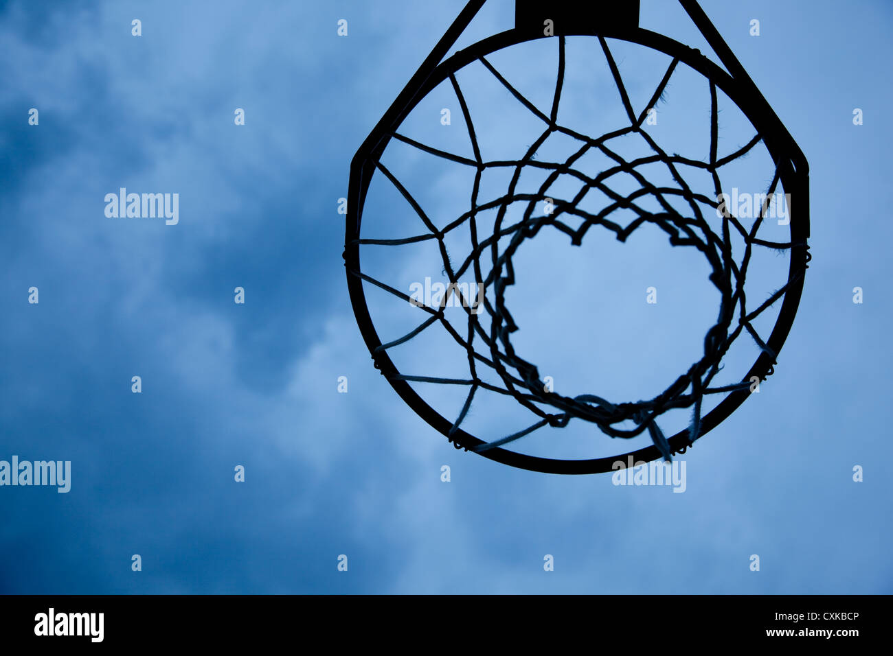A basketball hoop with a sky blue background Stock Photo - Alamy