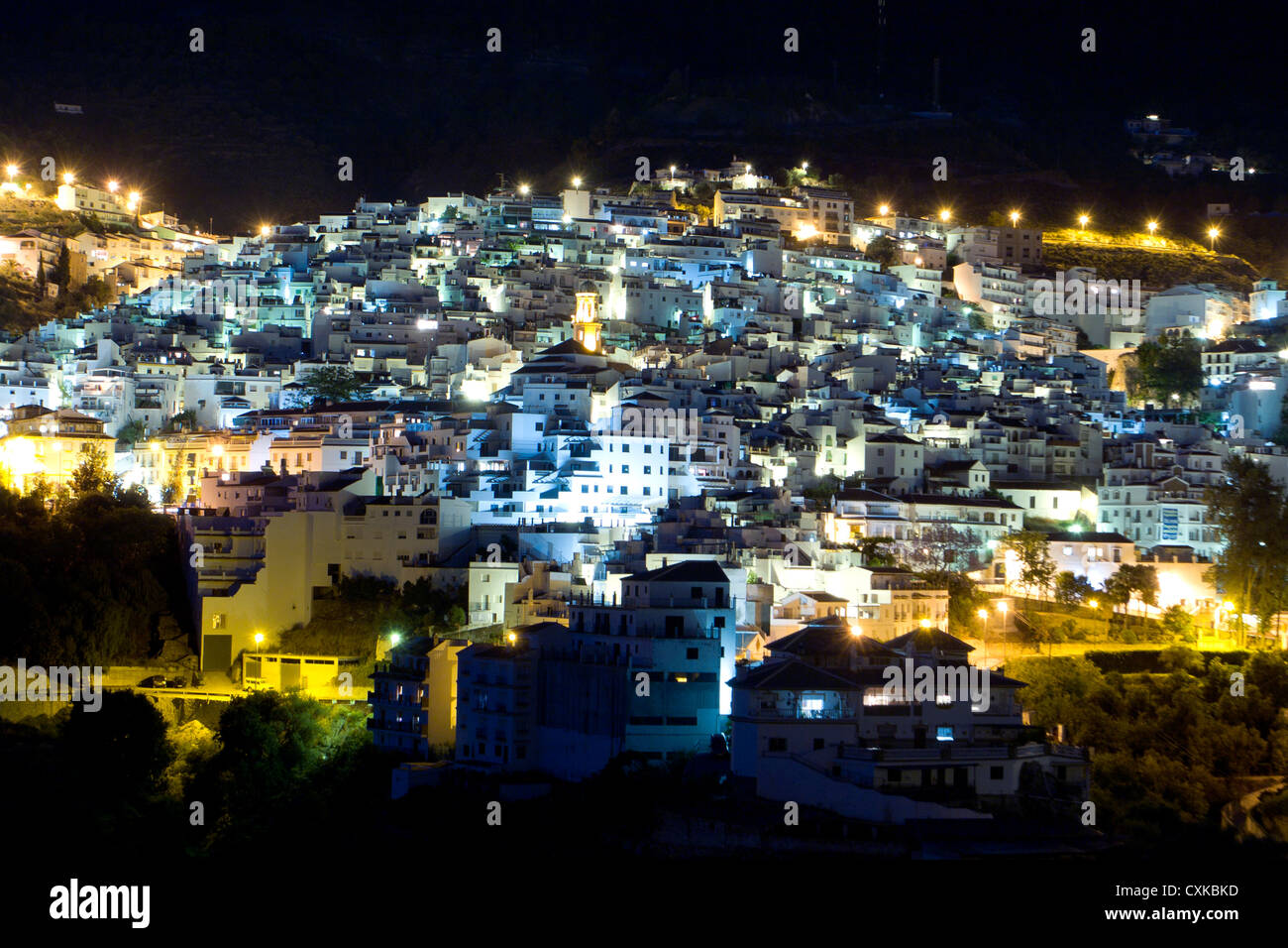 The village of Competa lit up at night in Andalusia, Southern Spain ...
