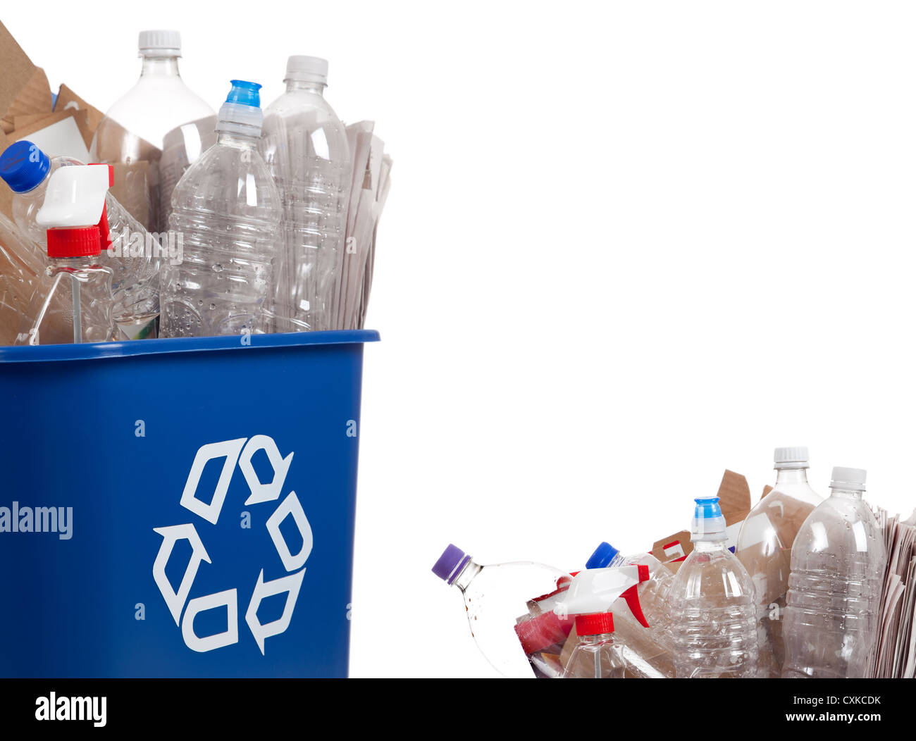 A blue recycle can with plastic bottles and paper on a white background ...