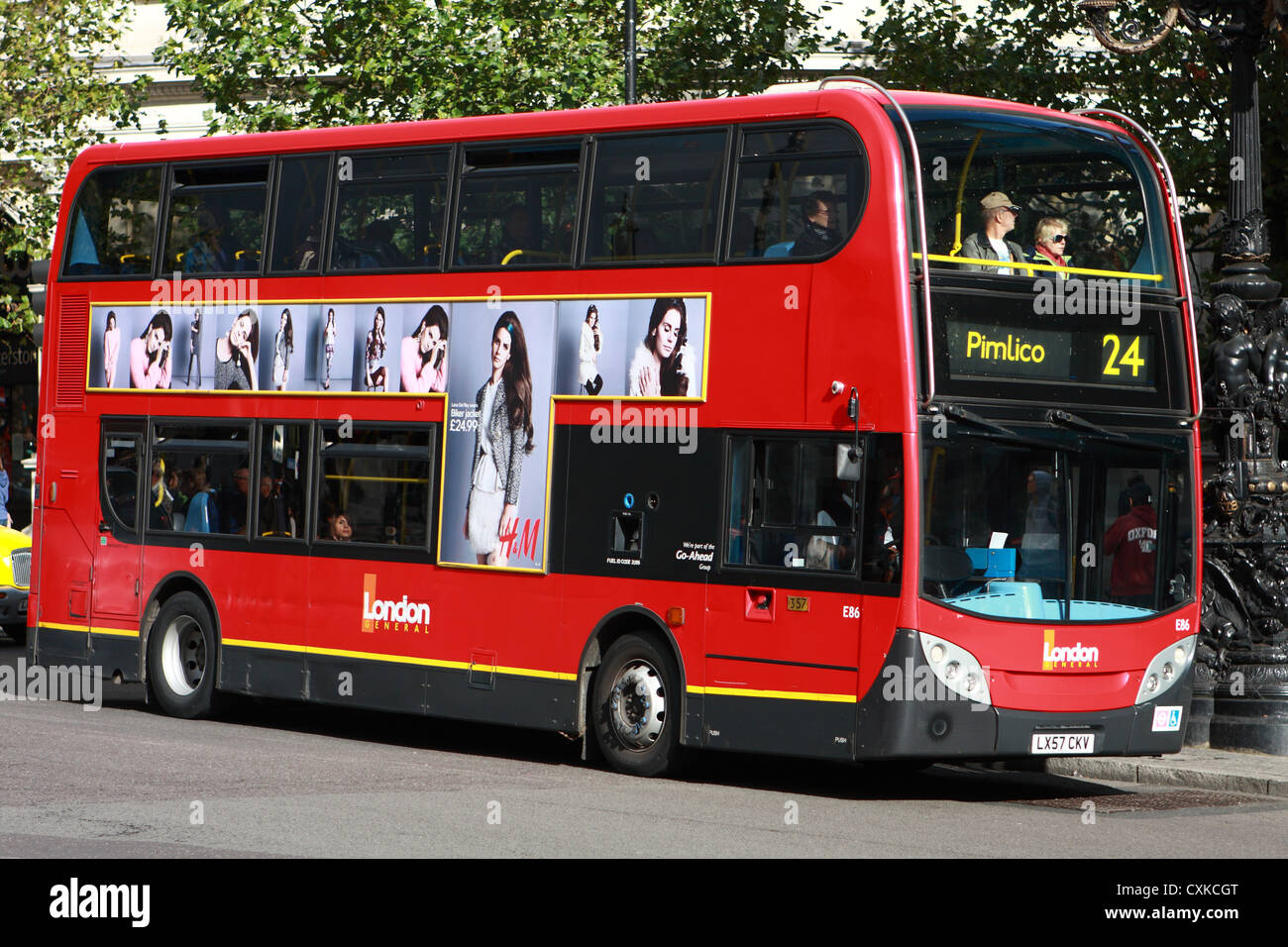 A red double decker bus traveling in London Stock Photo - Alamy