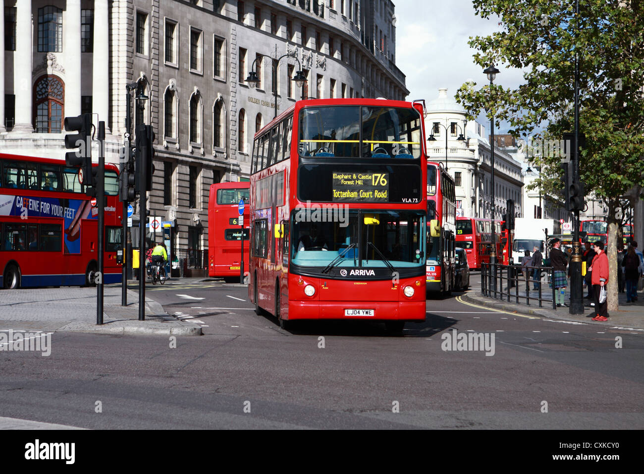 Red London double decker buses traveling in London Stock Photo - Alamy