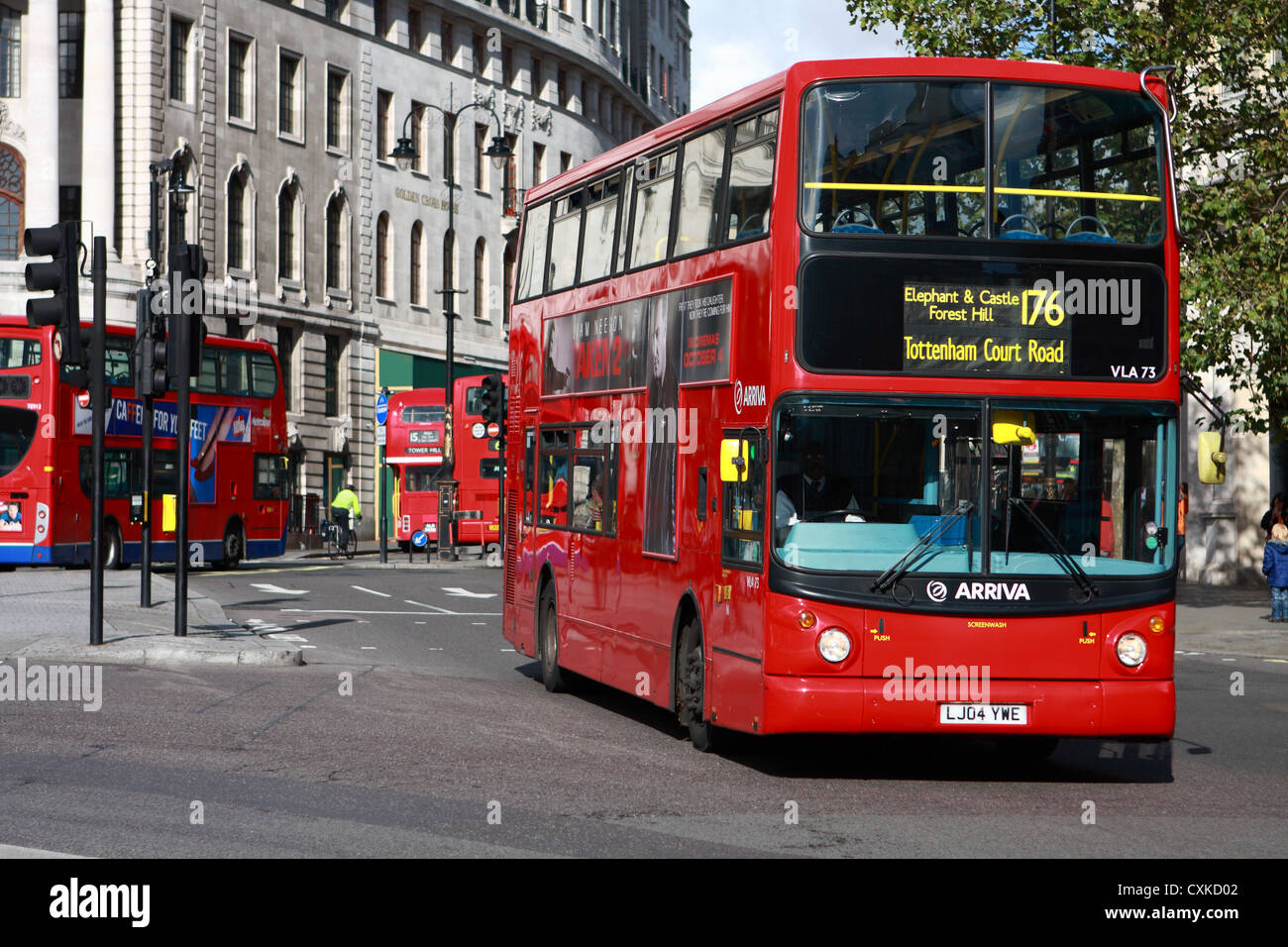 Red London double decker buses traveling in London Stock Photo - Alamy