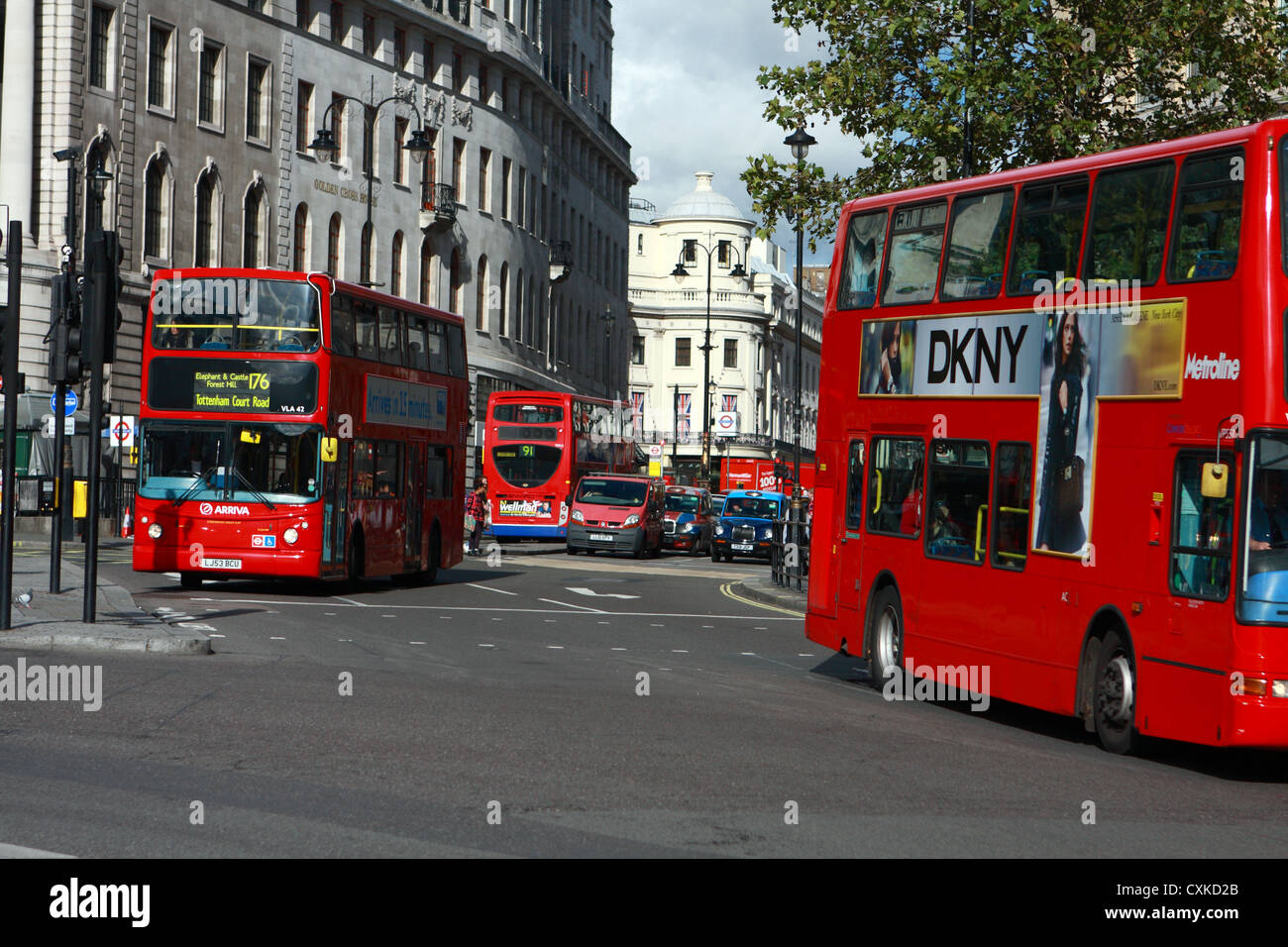 Red London double decker buses traveling in London Stock Photo - Alamy