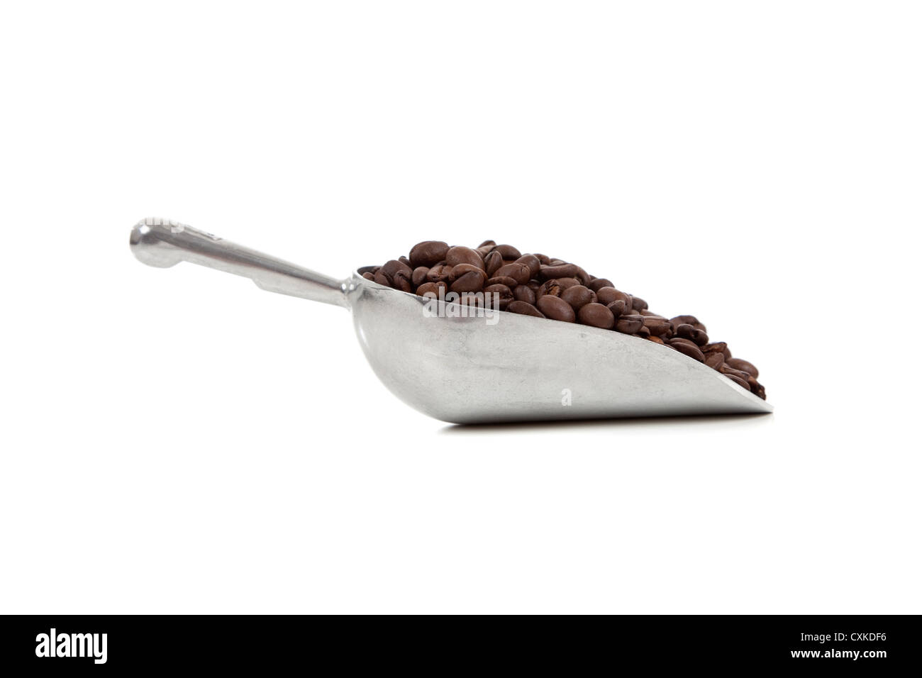 Silver scoop full of coffee beans on a white background Stock Photo - Alamy