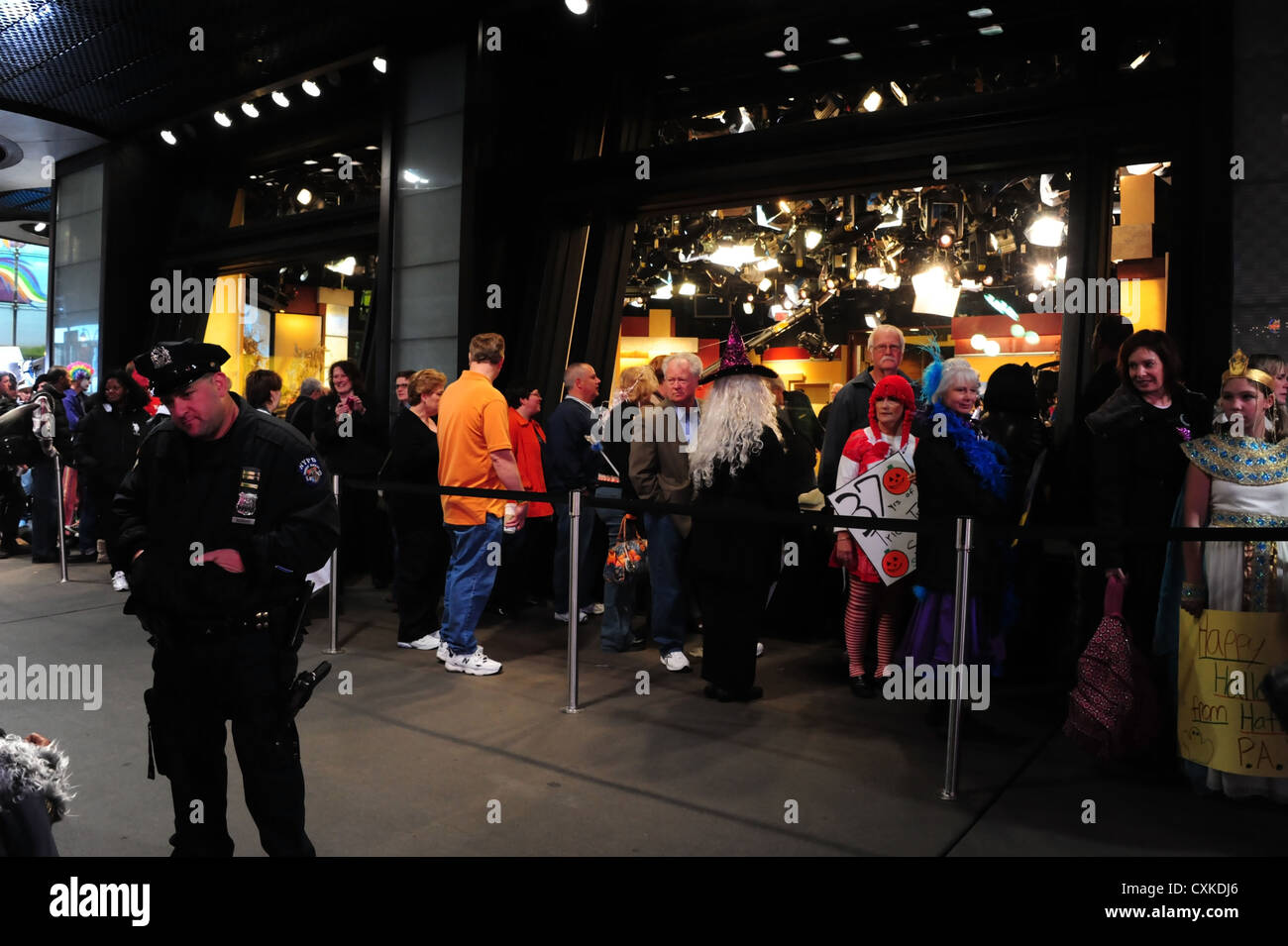 Dawn view NYPD police-man, people in Halloween costumes standing ...