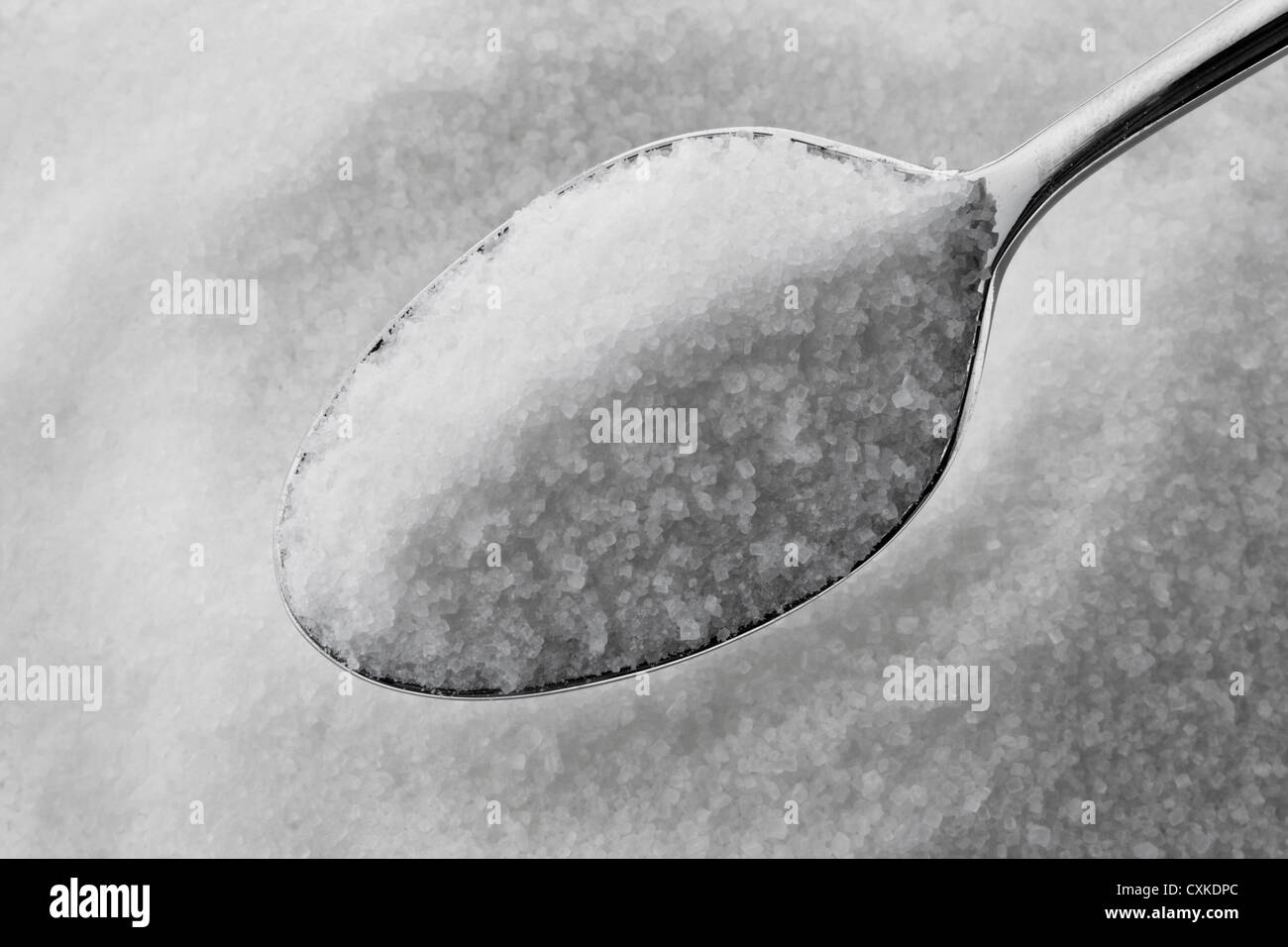 Granulated sugar on a spoon Stock Photo - Alamy
