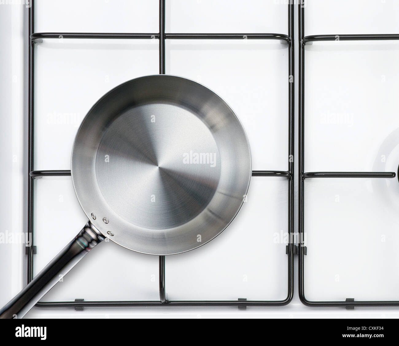 Empty steel frying pan on stove Stock Photo - Alamy