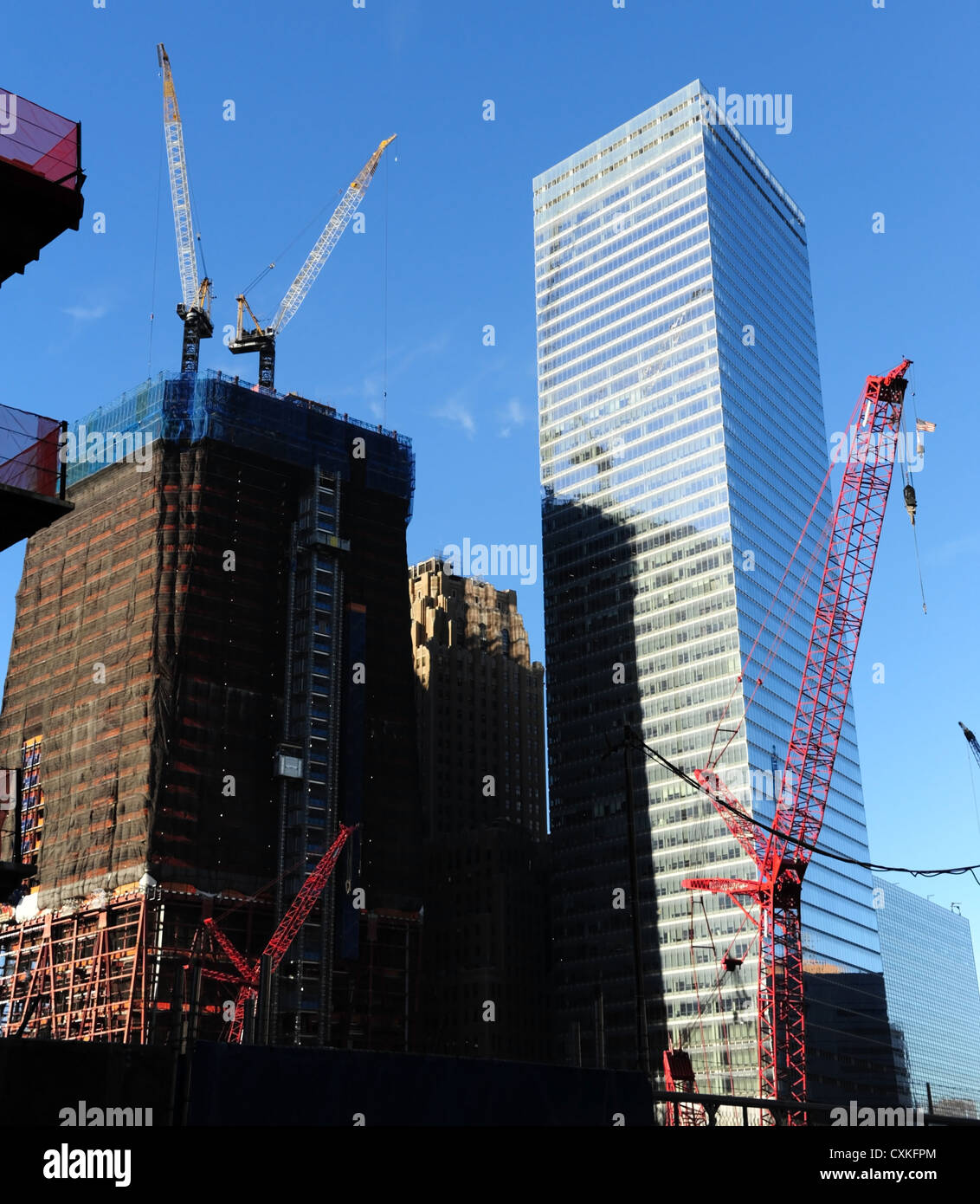 Blue sky cranes, unfinished World Trade Centre 1, finished World Trade ...
