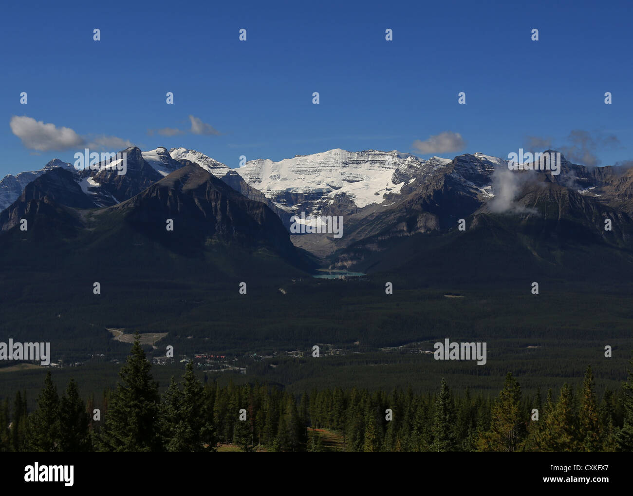 A distant view of Lake Louise with Mount Victoria rising behind it ...