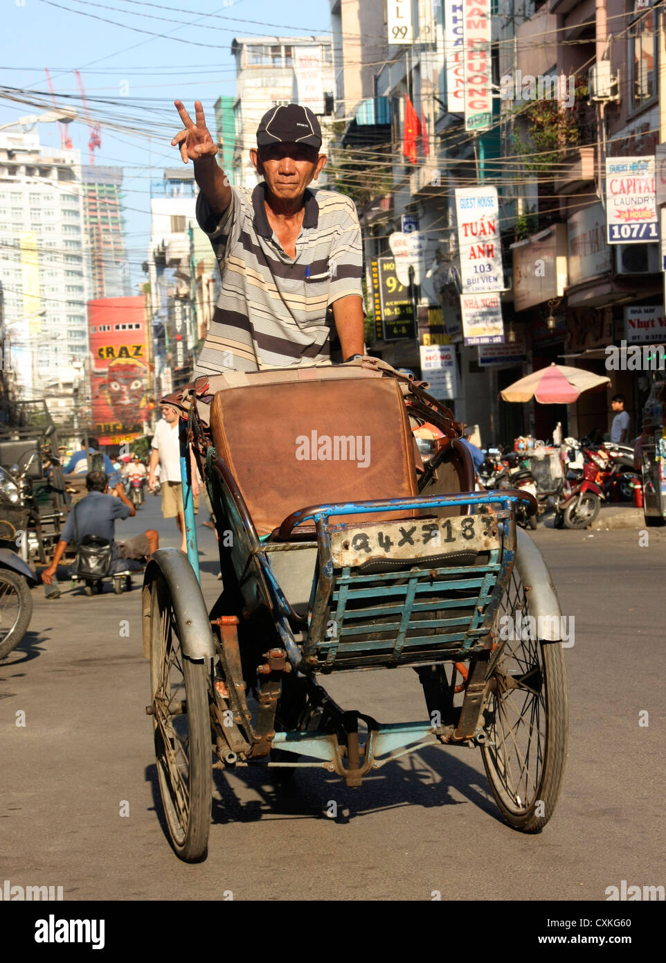 Tricycle rickshaw driver Saigon Vietnam Stock Photo - Alamy