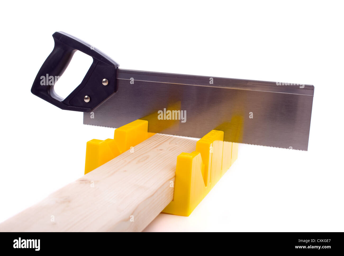 A small yellow miter box or saw on a white background Stock Photo - Alamy