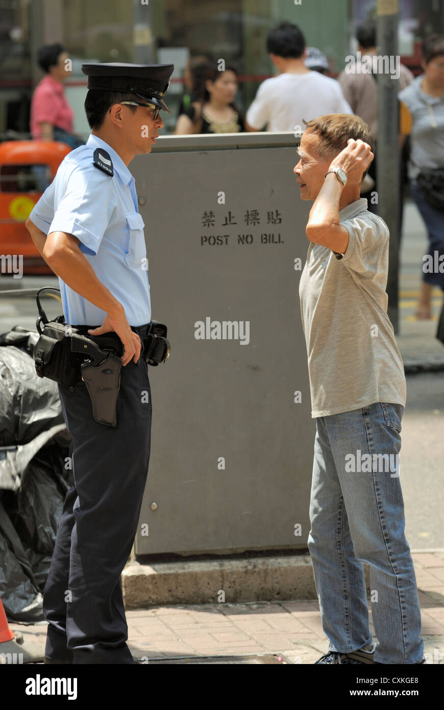 Man standing with a policeman hi-res stock photography and images - Alamy