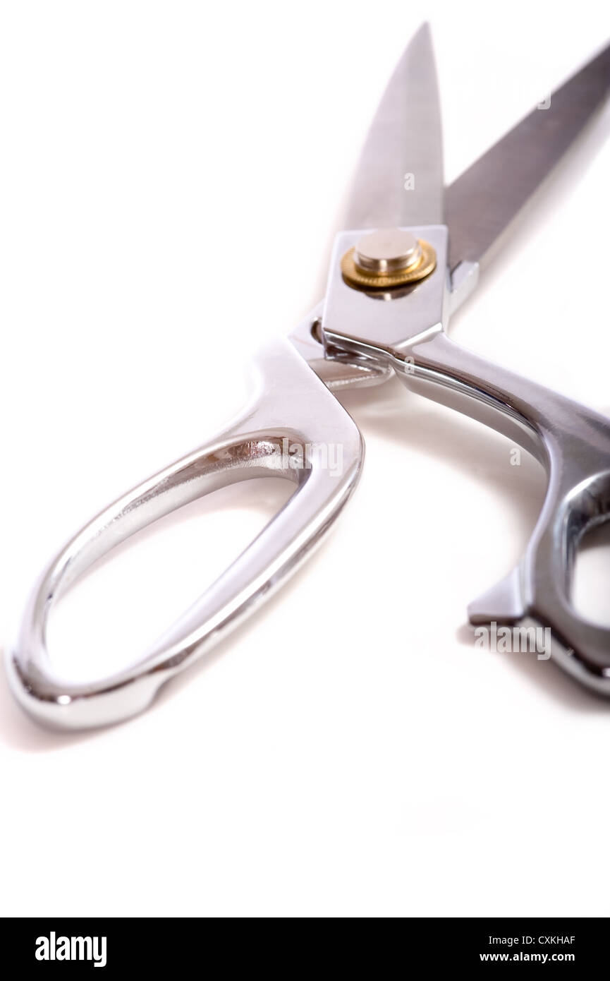 a pair of chrome dress shears or ceremonial scissors on a white ...