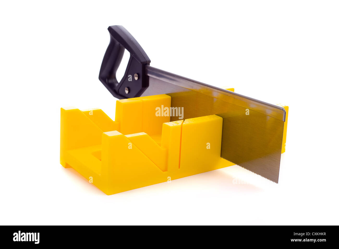 A small yellow miter box or saw on a white background Stock Photo - Alamy