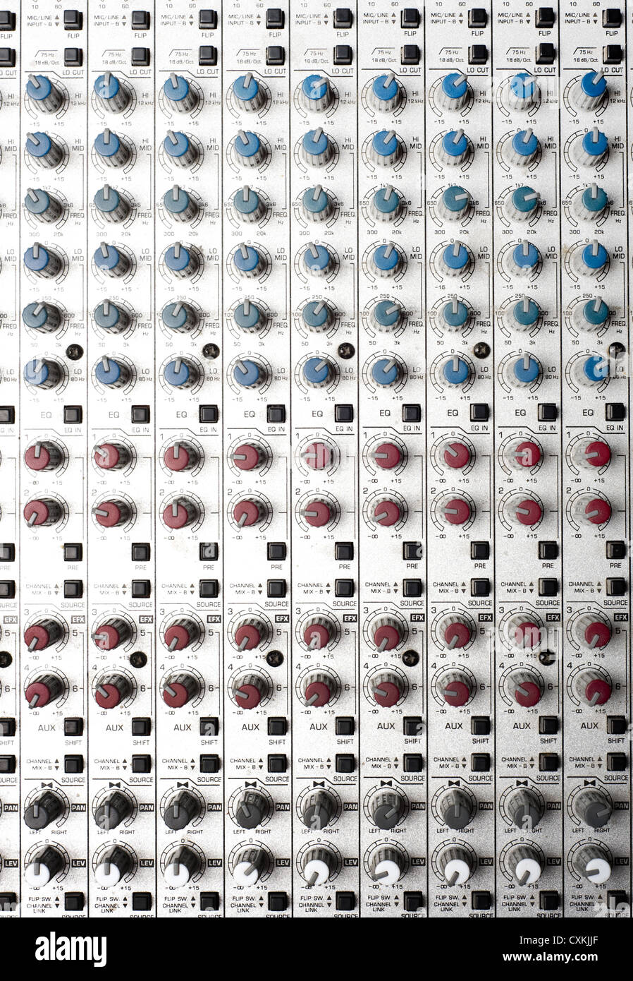 Audio recording equipment or soundboard background with many knobs and ...