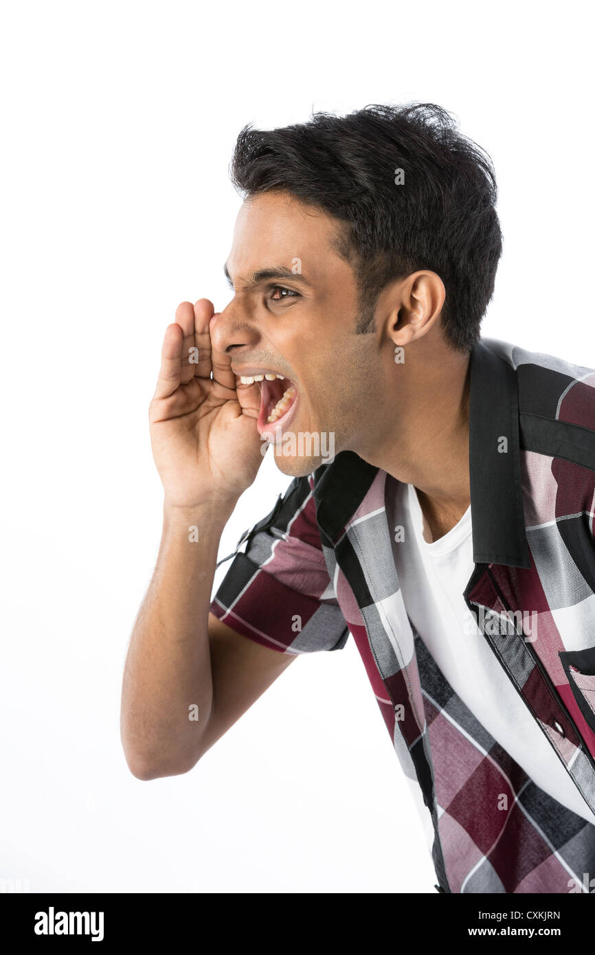 Angry Indian man shouting his message. Isolated against a white ...