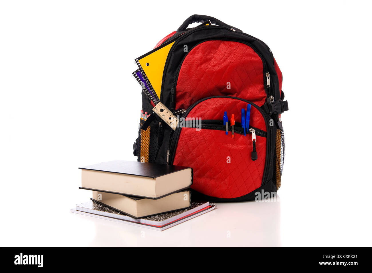 A red overflowing school backpack or book bag with school books on a ...