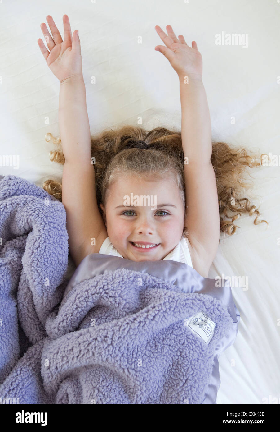 Little girl covered with soft blanket Stock Photo - Alamy