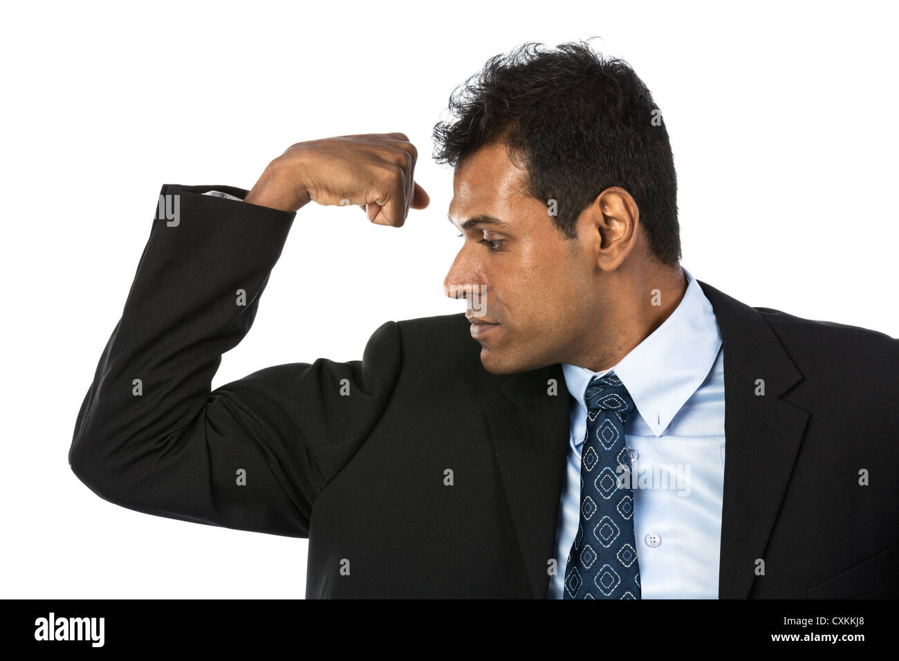 Indian business man flexing his bicep. Concept about power and strength ...