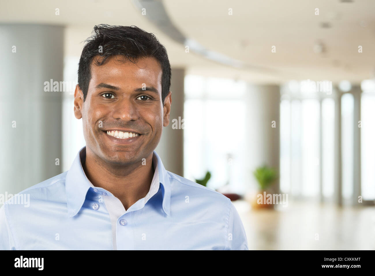 Happy Indian business man at the office Stock Photo - Alamy