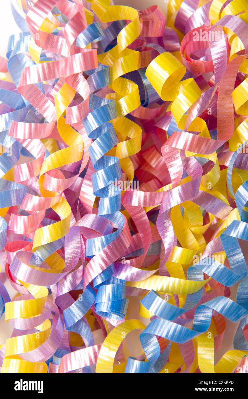 A curly ribbon or bow background. Birthday present wrapping Stock Photo ...