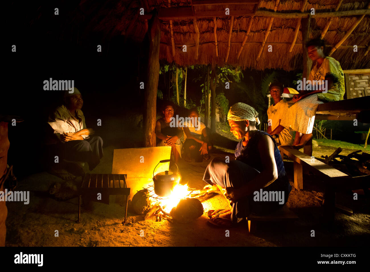 Women preparing and cooking food in a traditional haus cook (kitchen ...
