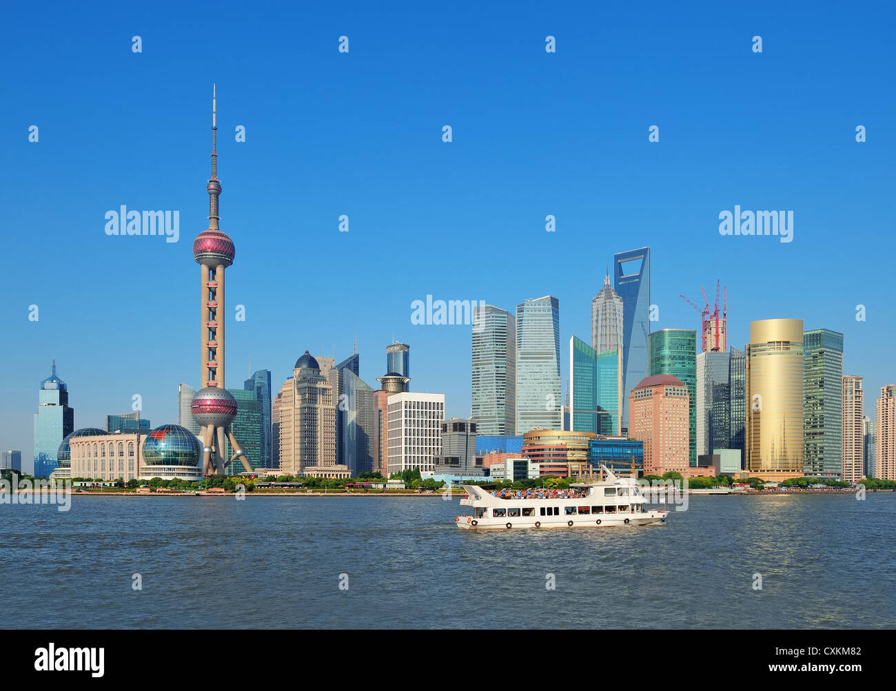 Shanghai skyline with skyscrapers and blue clear sky over Huangpu River ...