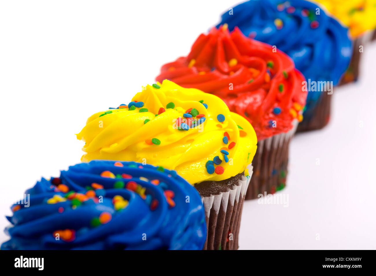 Colorful cupcakes with colorful icing and decorations Stock Photo - Alamy