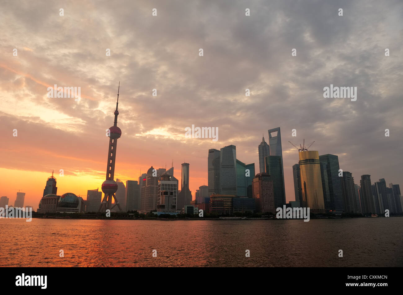 Shanghai morning city skyline silhouette over river with sunrise and ...