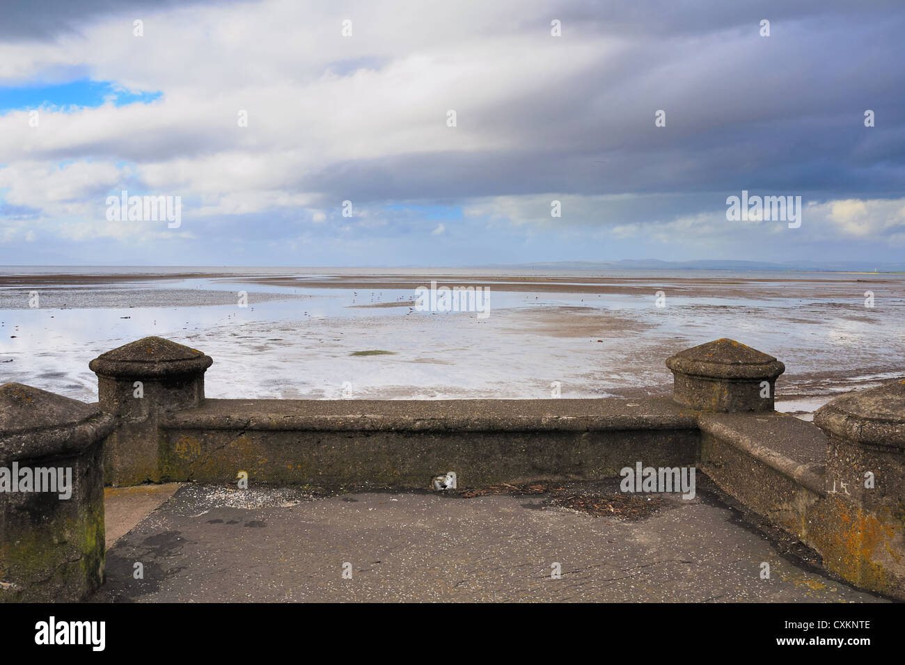 The view from the shore road in Troon. The tide is well out and the sky ...