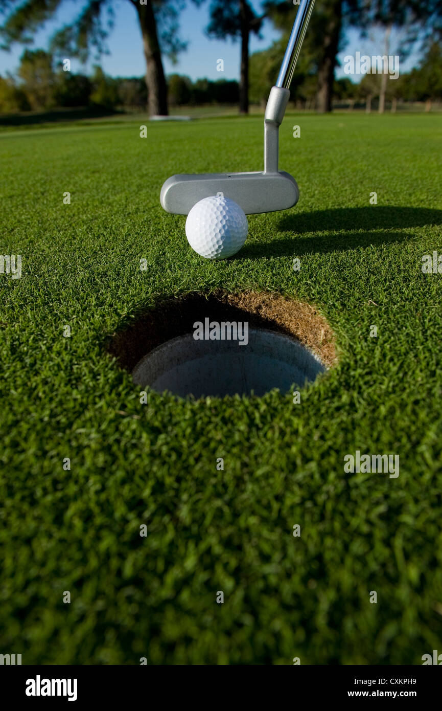 A short put in the game of golf with a ball and a putter Stock Photo ...