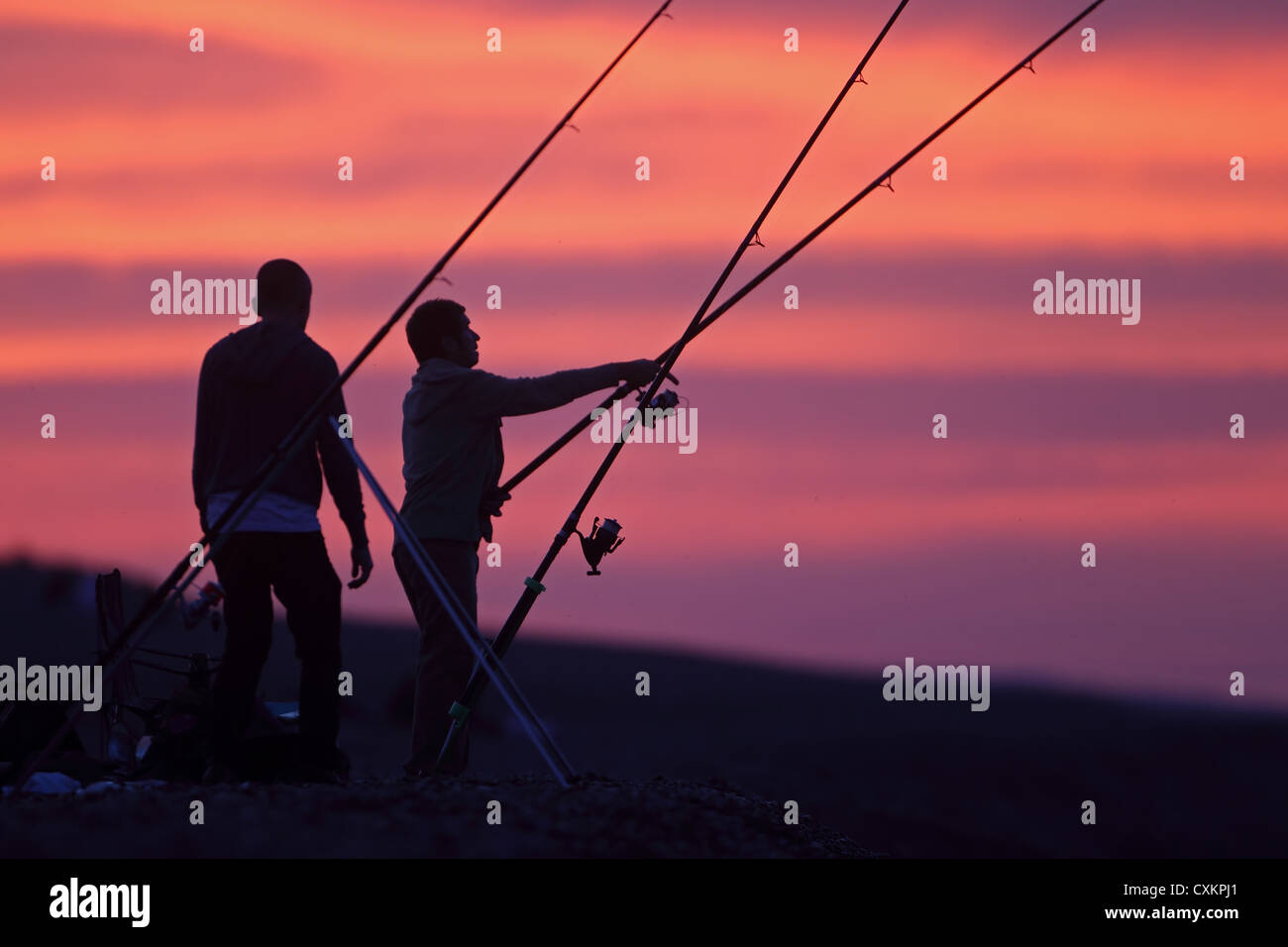 Fisherman at Sunset Stock Photo - Alamy