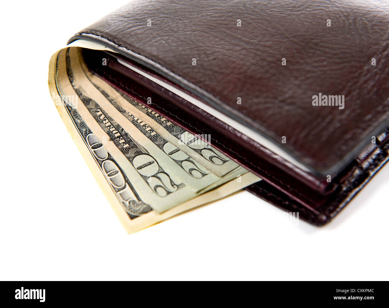 A brown leather wallet with money sticking out on a white background ...