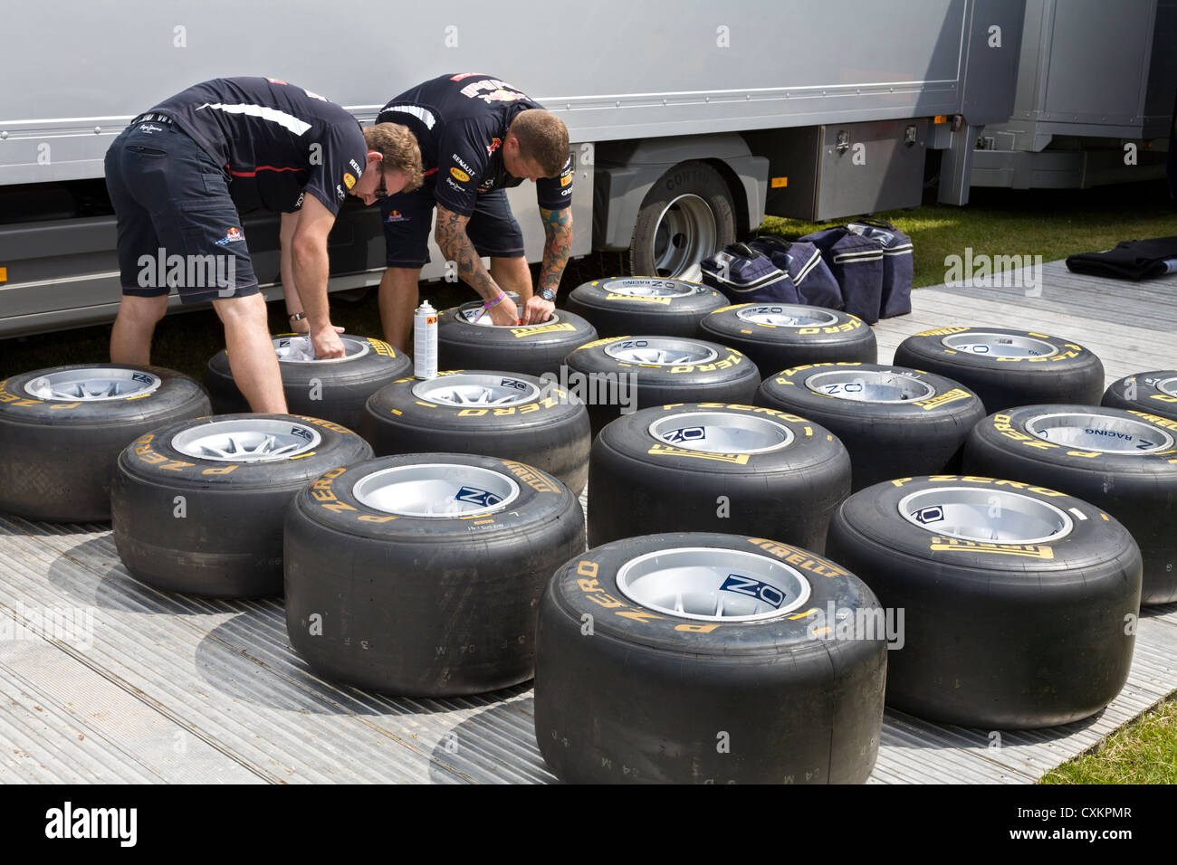 Red Bull F1 Racing mechanics check and adjust tyre pressures at the ...