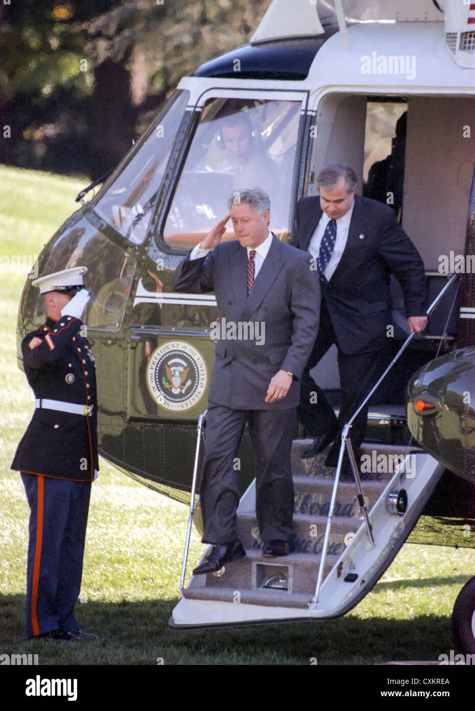 US President Bill Clinton salutes as he and National Security Advisor ...