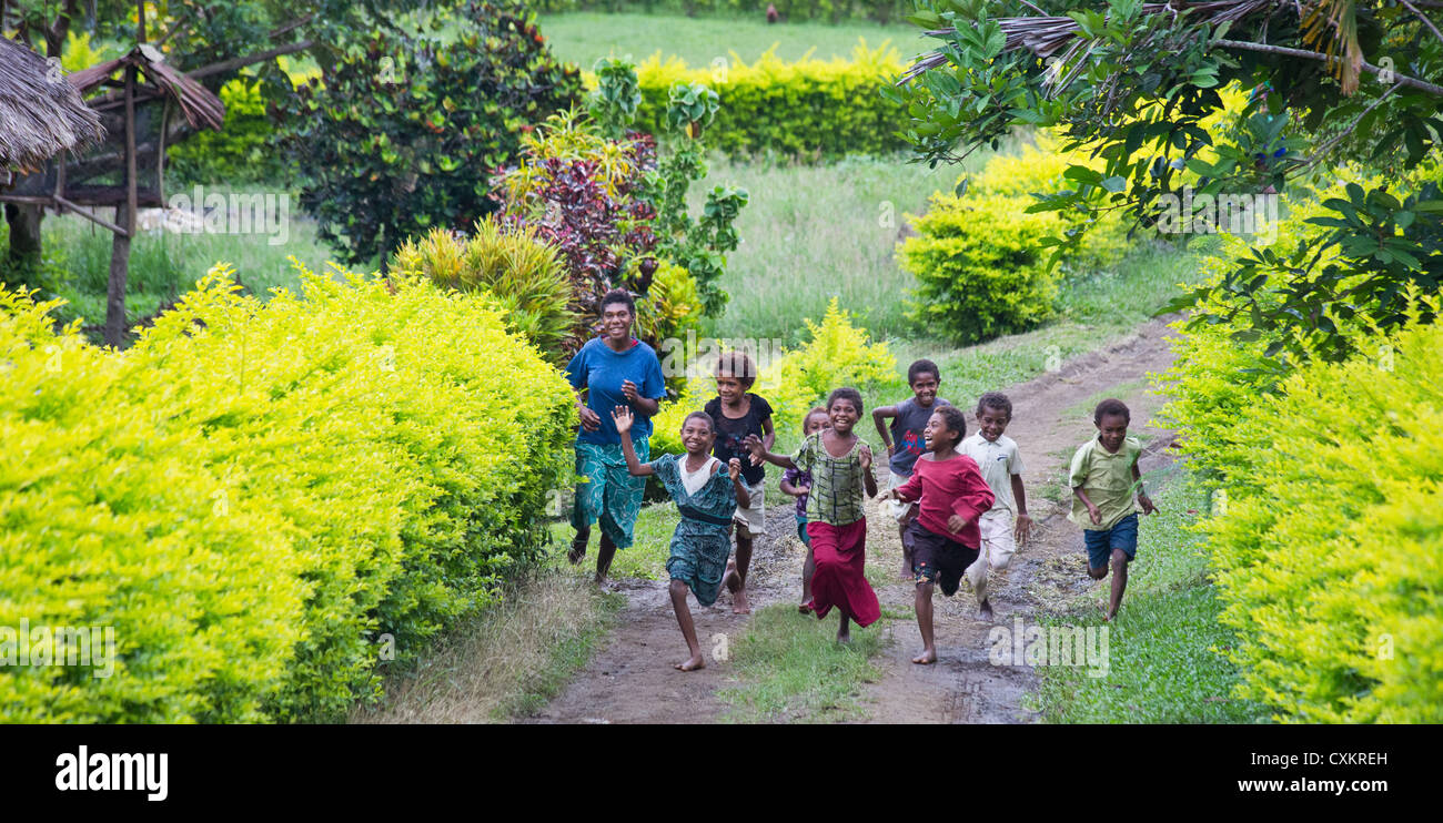 Children running towards camera in a traditional Yonki village, Erap ...