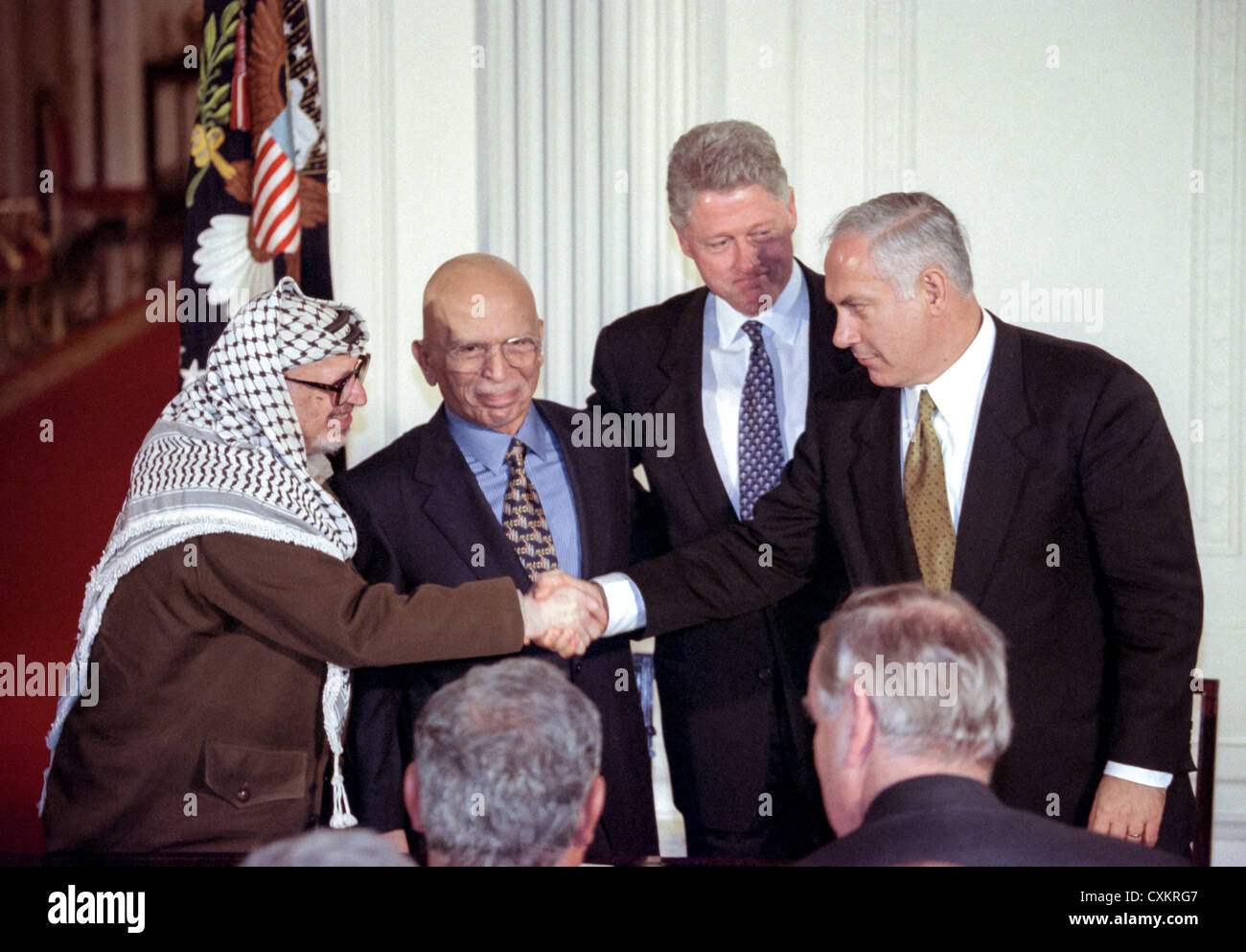 Palestinian Leader Yasser Arafat shakes hands with Israel Prime ...