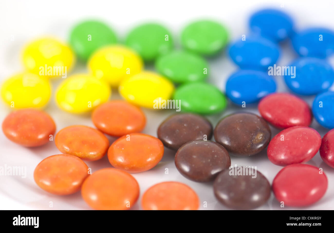 Mix of candies on white background Stock Photo - Alamy