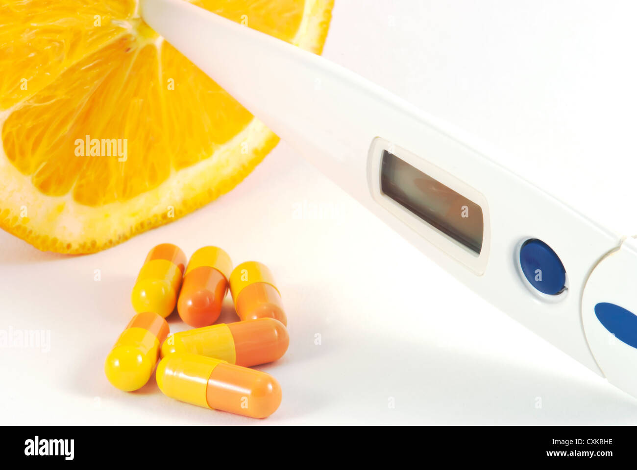 Orange fruit with vitamins and termometer Stock Photo - Alamy
