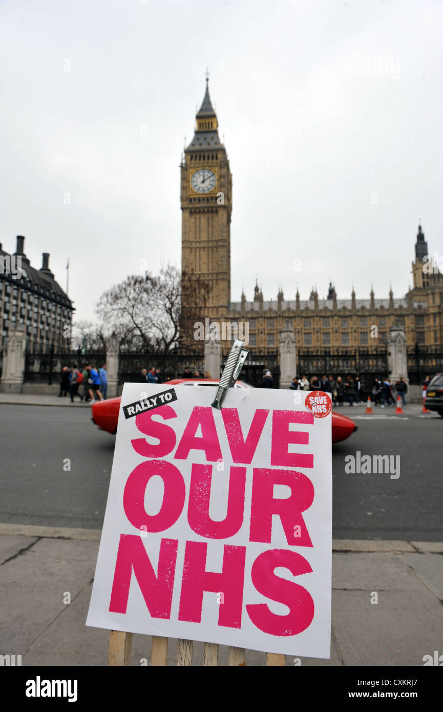 Save our NHS banner outside the houses of Parliament, Big Ben, London ...
