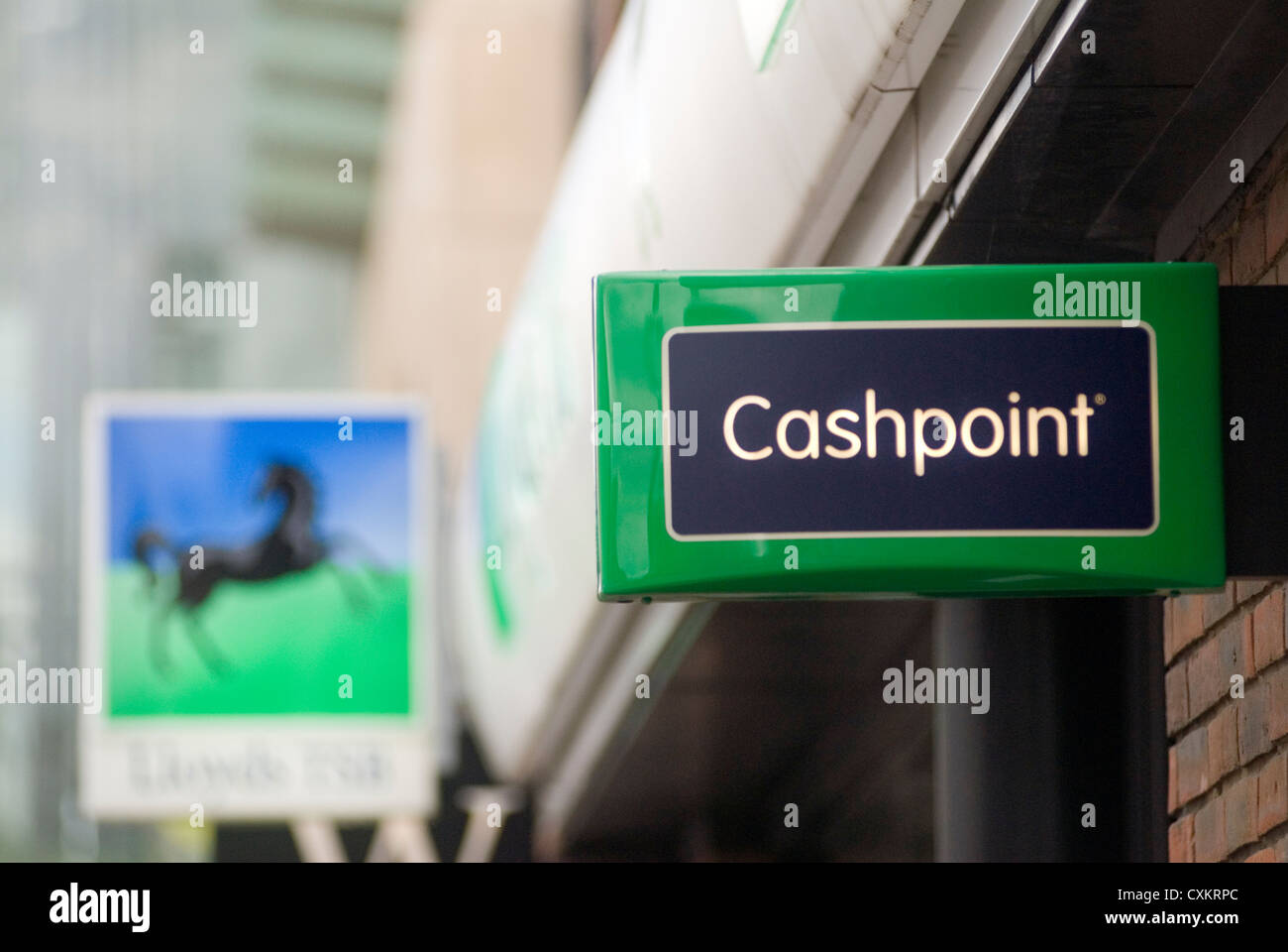 Cashpoint bank branch signs in the High Street. home counties UK 2007 ...