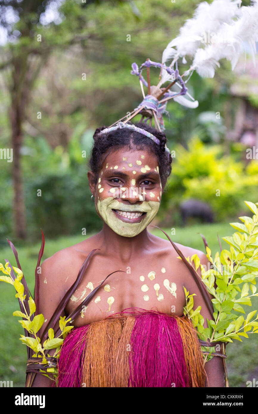 Portrait of a tribal woman wearing traditional dress in a small village ...