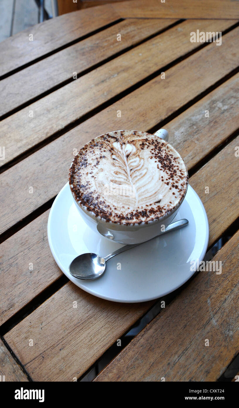 Cup of Coffee with Cream and Chocolate powder Stock Photo - Alamy