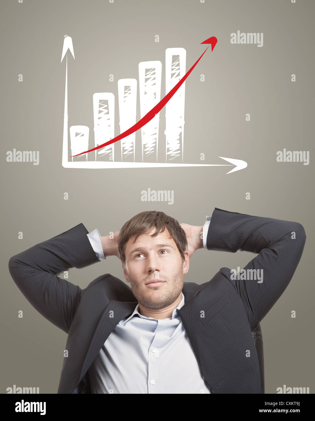 Business man in chair thinking with a rising chart diagram over his ...