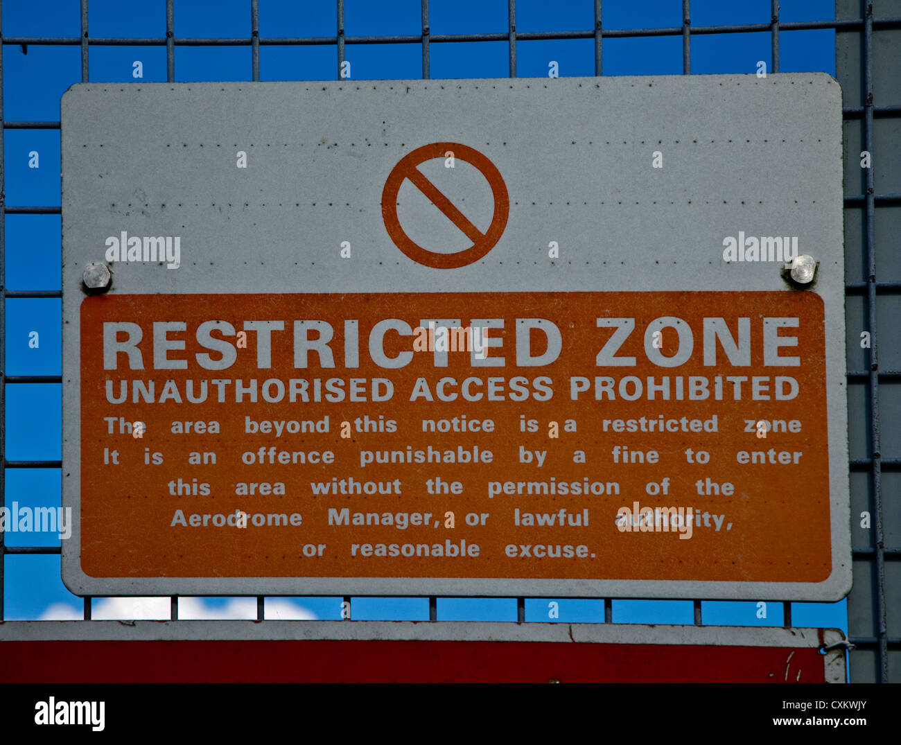 Restricted Zone sign on perimeter fence at Gatwick Airport, Crawley ...