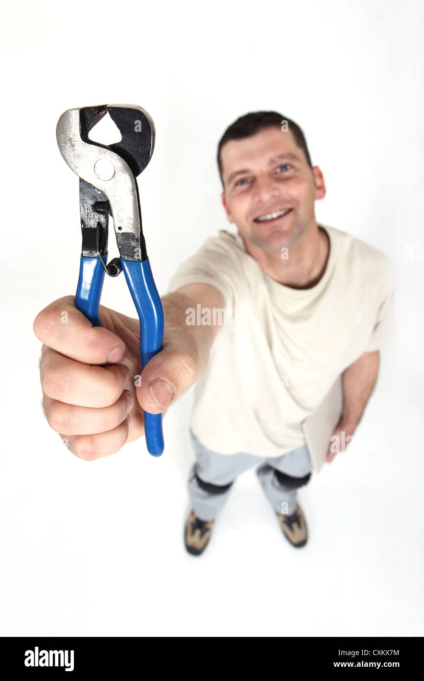 Man holding end-cutting pliers Stock Photo - Alamy